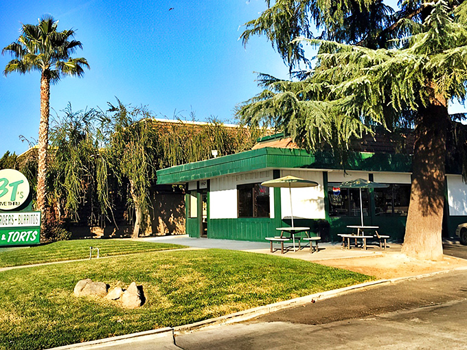 That green and white exterior isn't just charming – it's your first hint that serious comfort food awaits inside.