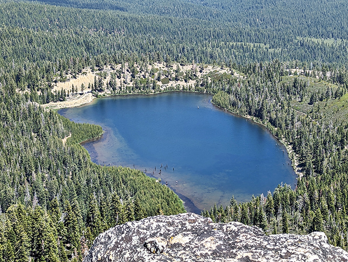 Nature's infinity pool! This aerial view of Plumas-Eureka's alpine lake surrounded by emerald forests makes Tahoe look like a kiddie pool.