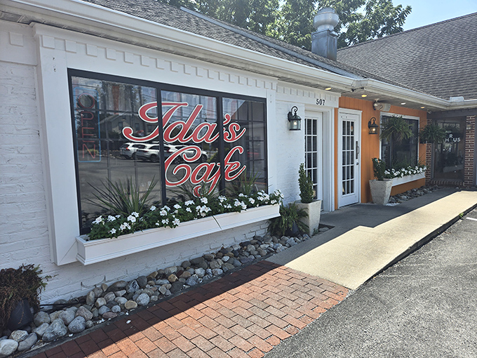 The bright orange door at Ida's Cafe isn't just an entrance—it's an invitation to breakfast paradise in Lancaster's cozy countryside.