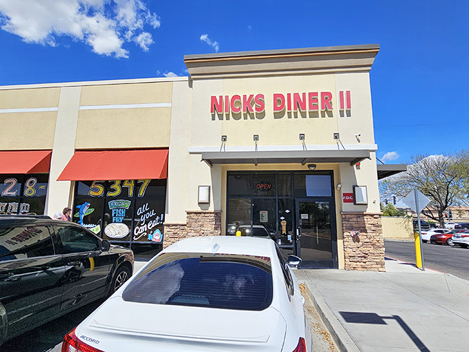 The unassuming storefront of Nick's Diner II stands like a beacon of breakfast hope amid the Arizona sunshine. Classic diner signage promises comfort food treasures within.
