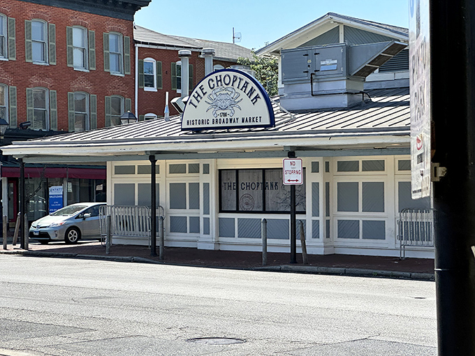 The grand entrance arch to The Choptank stands like a portal to seafood paradise, complete with that iconic Maryland blue crab emblem.