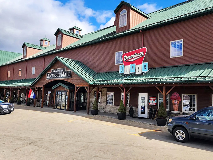 The red barn exterior isn't just eye-catching&mdash;it's a siren call to treasure hunters everywhere. Green roof, rustic charm, and promises of vintage wonders await.