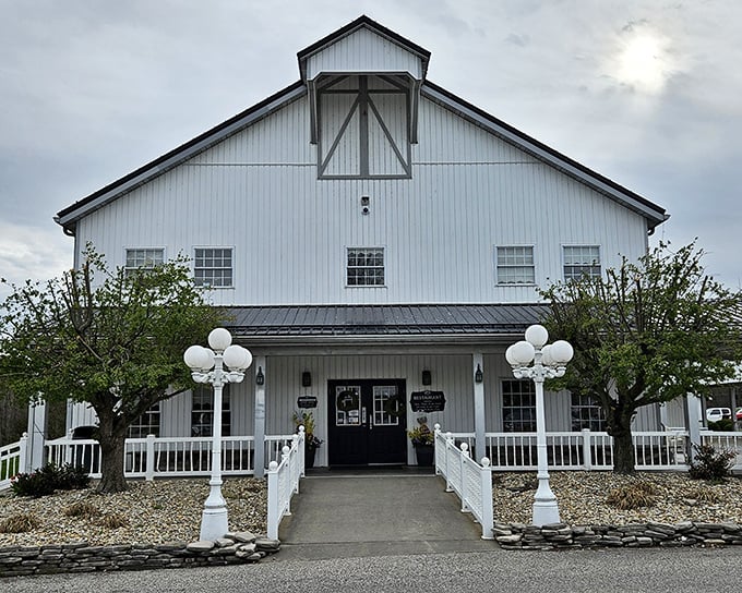 The stately white exterior of Gasthof Amish Village stands like a culinary lighthouse, beckoning hungry travelers with the promise of comfort food that transcends trends.