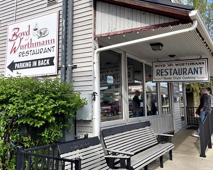 The classic white clapboard exterior with its signature green roof stands as a time capsule of Americana. Horse and buggy parking available!