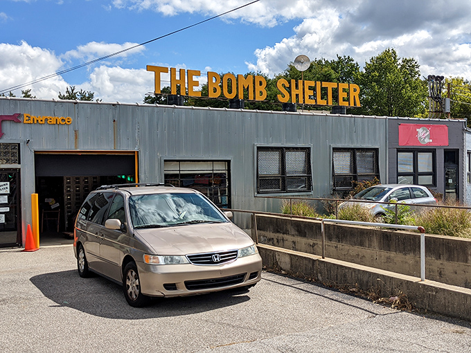 The unassuming exterior hides a universe of nostalgia behind that bright yellow nuclear symbol. Like finding a portal to the past in suburban Akron. 