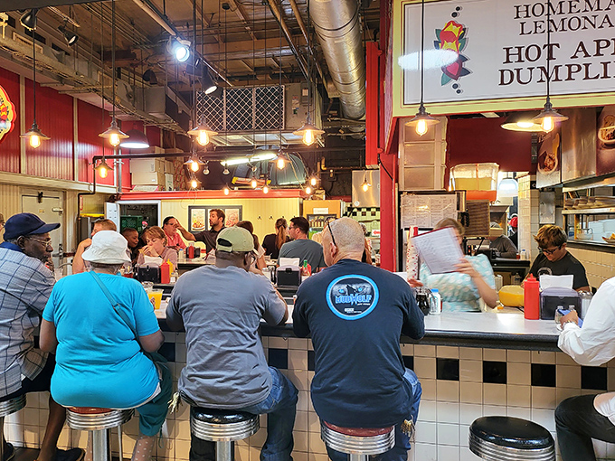 The iconic Dutch Eating Place sign promises culinary treasures within Reading Terminal Market. Those colorful hearts aren't just decoration&mdash;they're a preview of the heartfelt cooking awaiting you.