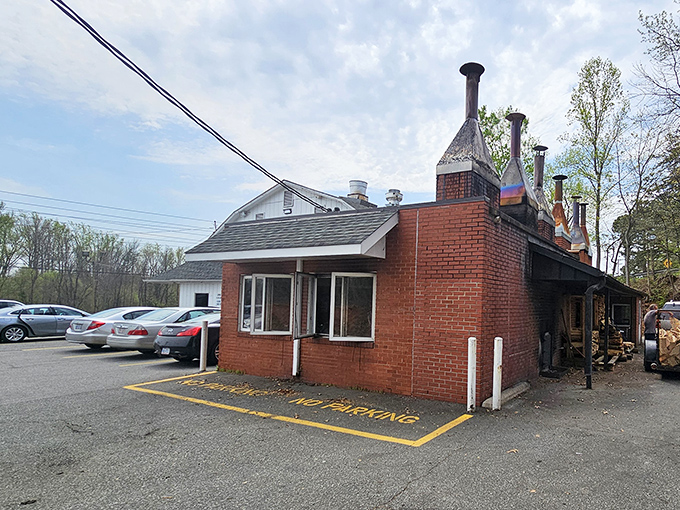 The unassuming building with its brick facade stands like a barbecue beacon, promising smoky delights within its humble walls.