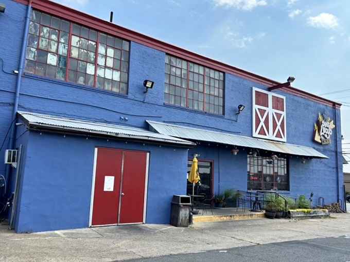 The blue barn-like exterior with its distinctive red trim isn't just eye-catching&mdash;it's a smoke signal to BBQ lovers that authentic goodness awaits inside.