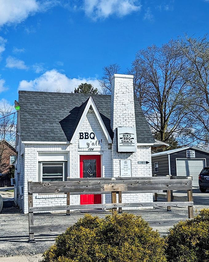 The little white brick house with the red door isn't just charming&mdash;it's BBQ headquarters. That "BBQ y'all" sign is basically Indiana's version of the pearly gates.