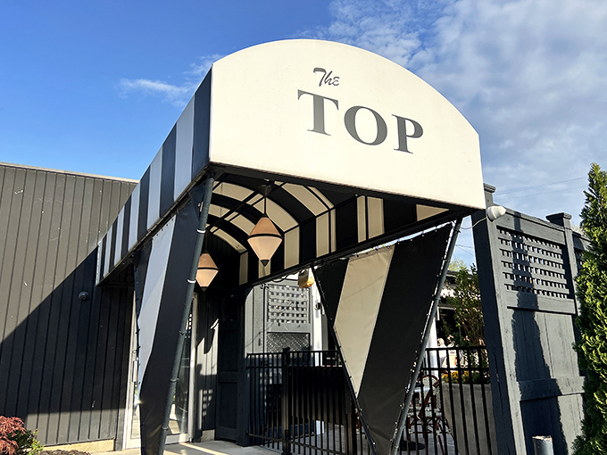 The geometric entrance to The Top Steak House looks like it was plucked straight from a mid-century modern design magazine. Pure retro cool.