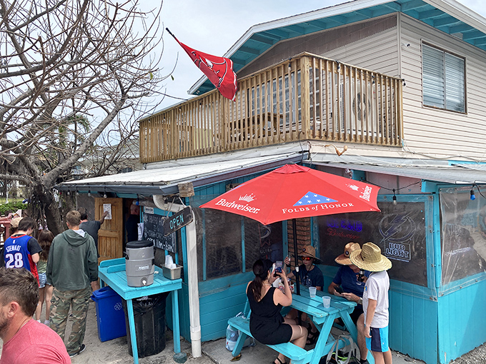 The turquoise-trimmed beach shack with an American flag proudly waving says everything you need to know: unpretentious food paradise ahead. 