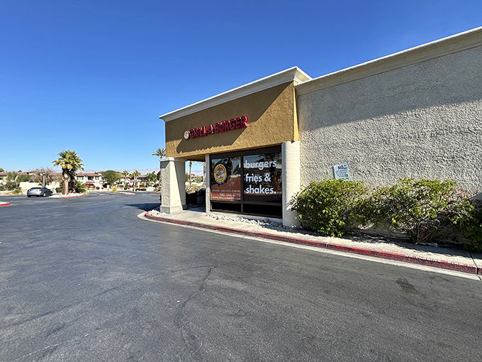 The unassuming exterior of Grill-A-Burger stands like a culinary mirage in the Palm Desert heat, promising delicious relief to hungry travelers.
