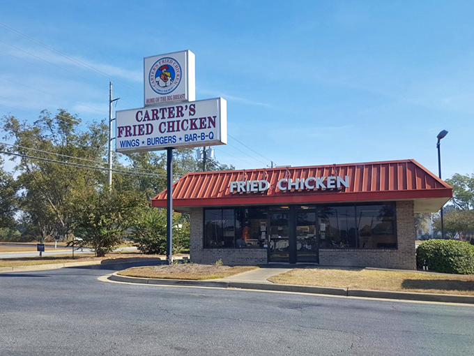The bright orange roof of Carter's Fried Chicken stands out like a beacon of hope for hungry travelers. Georgia Strong, indeed.