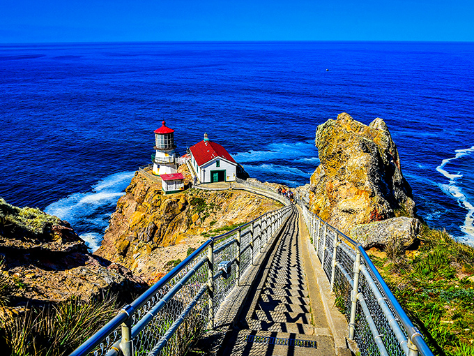 The iconic Point Reyes Lighthouse perched dramatically on the cliff's edge, where the stairway to heaven meets the highway to spectacular ocean views.