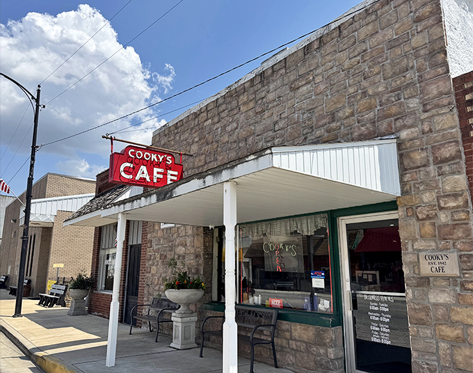 The stone facade and vintage red sign of Cooky's Cafe stand as a time capsule of Americana in Golden City's downtown, welcoming hungry travelers for generations.