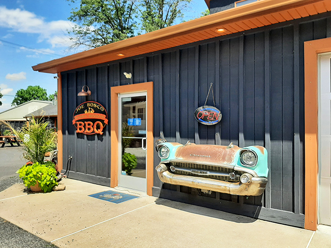 The classic car front boldly mounted on this blue-gray exterior isn't just decoration&mdash;it's a promise that something timelessly delicious awaits inside.