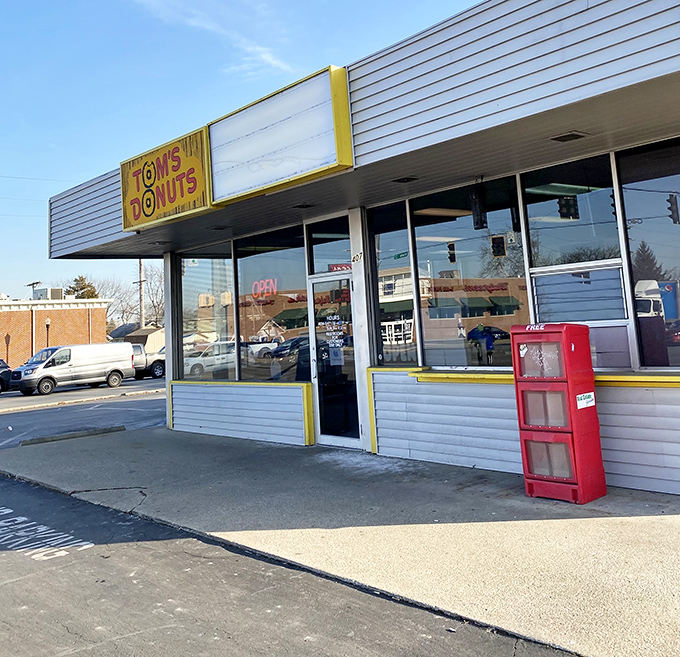 The unassuming exterior of Tom's Donuts stands like a beacon of sweetness in Fort Wayne, promising simple pleasures without the fancy frills.