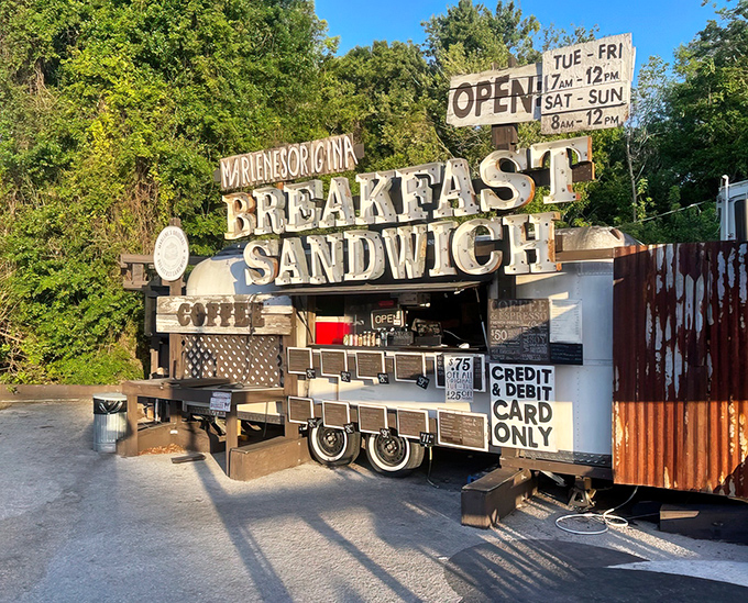 The holy grail of breakfast isn't hiding in some fancy hotel - it's right here in this rustic food stand with a sign that tells you exactly what you're getting.