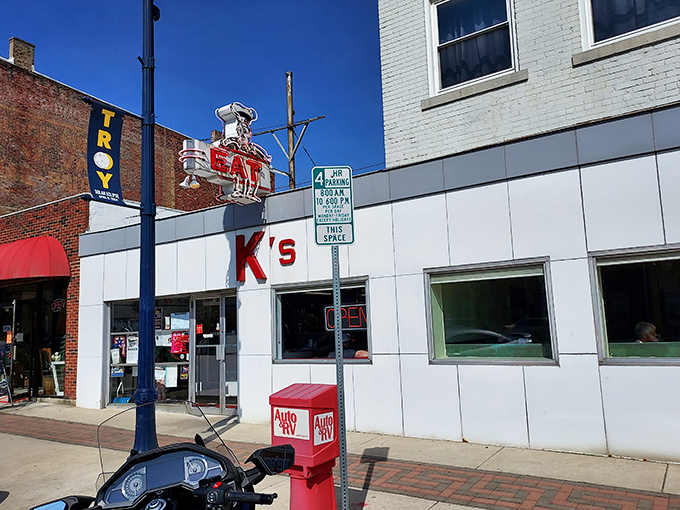 The iconic K's storefront beckons with its vintage "EAT" sign &ndash; a neon command that's impossible to ignore and even harder to disobey.