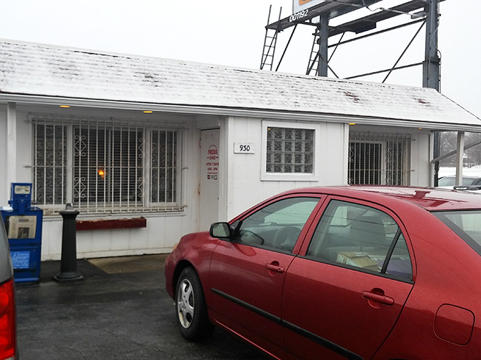Fred's Diner stands like a humble white sentinel with its distinctive red roof, proving that culinary treasures often hide in plain sight.