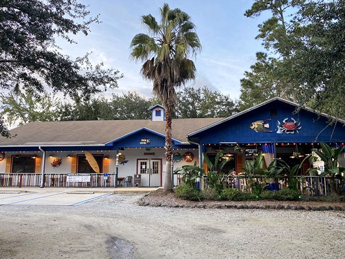 The Blue Crab's cheerful exterior welcomes you like an old friend, with palm trees standing guard and colorful crab decorations hinting at the treasures within.