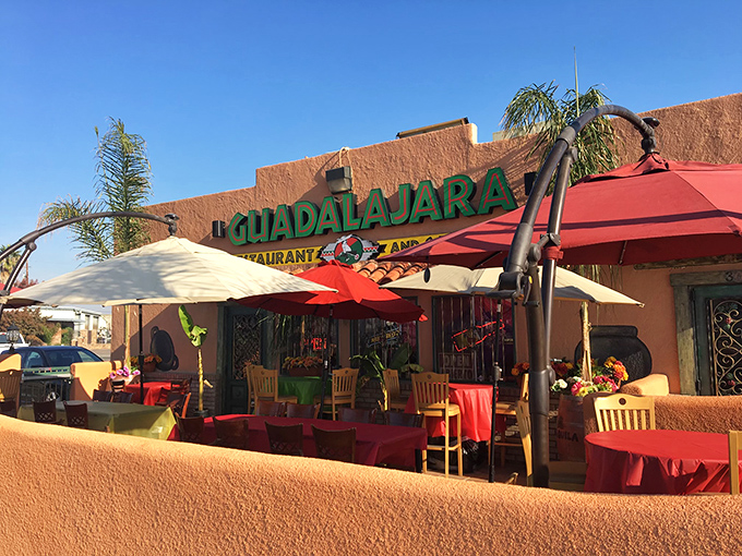 The terra-cotta facade of Guadalajara Restaurant glows in the California sunshine, its vibrant umbrellas promising shade and culinary treasures within.