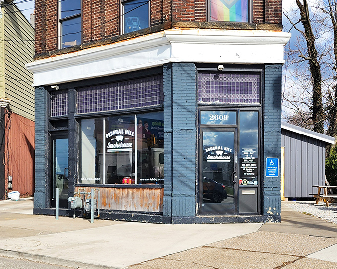 The unassuming blue corner building that houses Federal Hill Smokehouse might not look like barbecue paradise, but trust me—culinary miracles happen inside these brick walls.