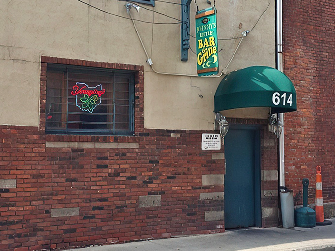 The unassuming entrance to Johnny's Little Bar might be Cleveland's best-kept secret. That green awning marks the spot where burger dreams come true.