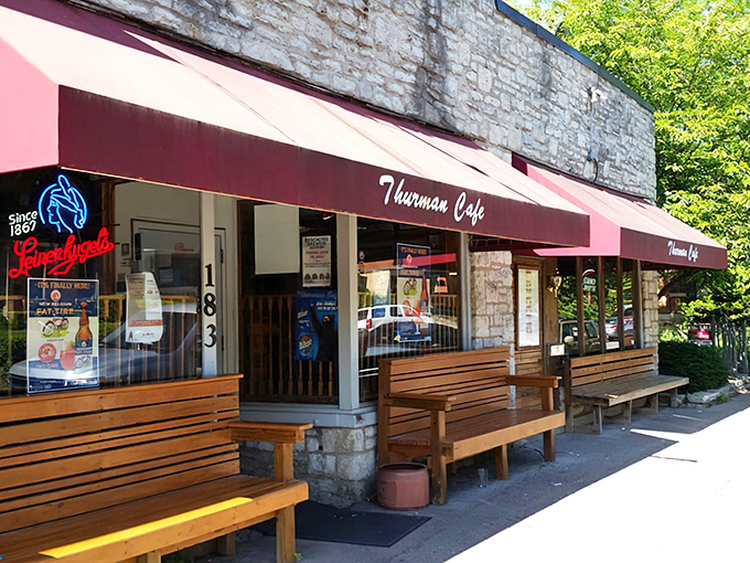 The unassuming stone exterior of Thurman Cafe, with its signature red awning, belies the gastronomic adventures waiting inside this Columbus landmark.