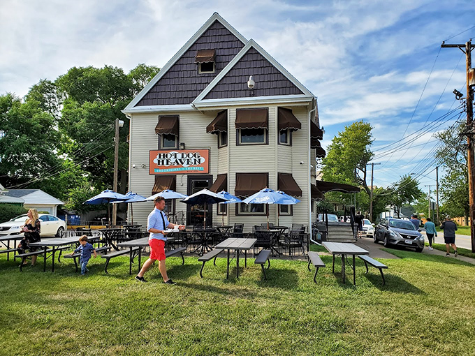 The welcoming exterior of Hot Dog Heaven stands like a beacon of comfort food in Amherst, complete with charming striped awnings that practically whisper "come get your chili dog fix."