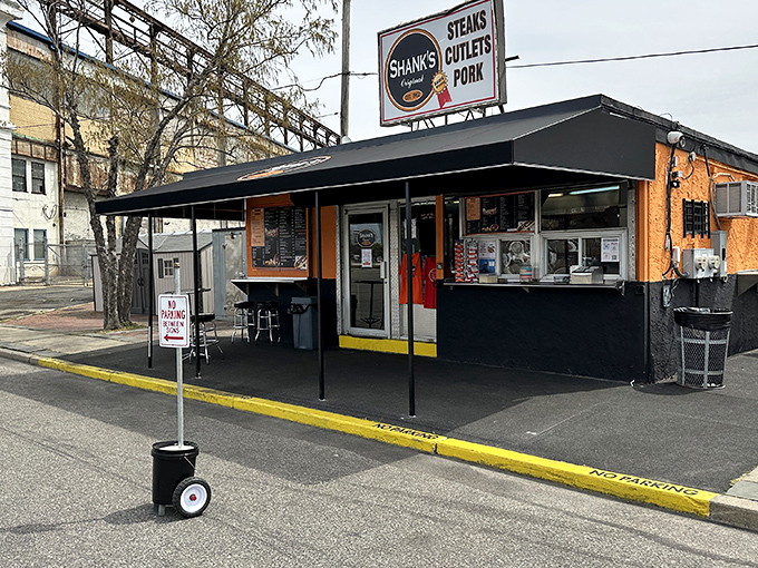 The unassuming orange and black exterior of Shank's Original stands like a sandwich sentinel on Pier 40, promising Philadelphia glory between two slices of bread.