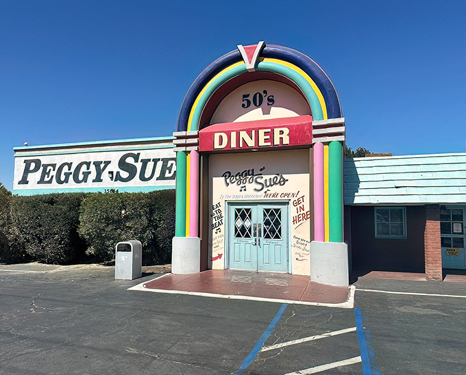 That rainbow-arched entrance isn't just a doorway&mdash;it's a time portal to an era when Elvis was king and milkshakes came with the metal mixing cup.