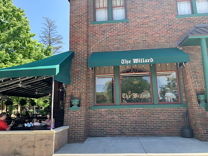 The Willard's brick exterior with its signature green awnings stands as Franklin's culinary lighthouse, beckoning hungry travelers with promises of Hoosier hospitality.