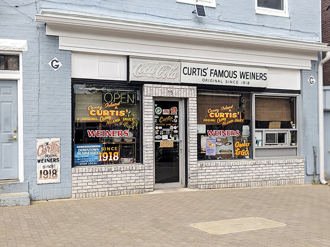 This unassuming storefront holds Cumberland's best-kept culinary secret, where chili dog dreams come true daily.