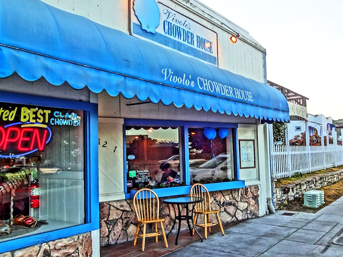 The iconic blue awning of Vivolo's stands out like a maritime flag, beckoning hungry travelers with the promise of chowder perfection.