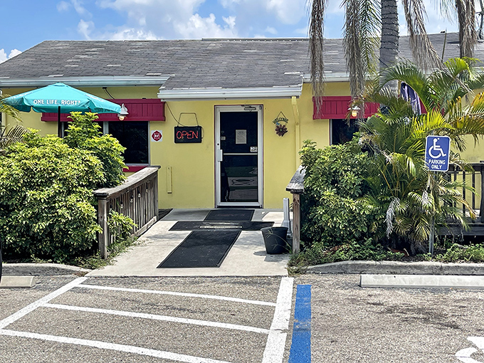 The cheerful yellow exterior of Leo's French Toast House welcomes hungry travelers with its bright facade and accessible entrance. Florida sunshine seems to radiate from the building itself.