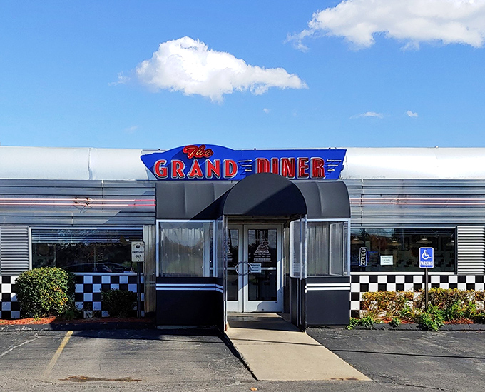 The silver exterior gleams like a time machine to the 1950s, with that iconic blue and red signage promising nostalgic delights within.