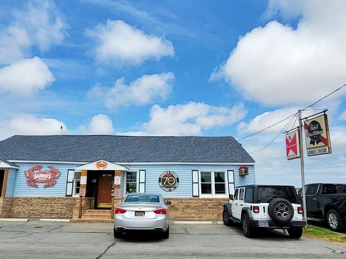 The unassuming blue exterior of Sambo's Tavern stands like a culinary lighthouse, beckoning seafood pilgrims to the shores of Leipsic with quiet confidence.