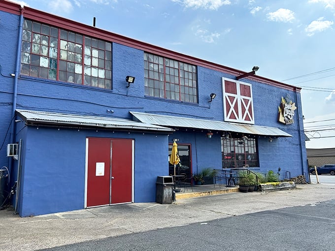 The bright blue exterior of Sweet Lucy's stands out like a barbecue beacon in Northeast Philly, complete with barn-style red accents.