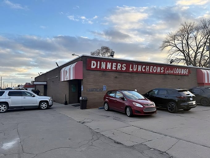 The unassuming exterior hides culinary greatness like a superhero's secret identity. This brick building houses Detroit pizza royalty.