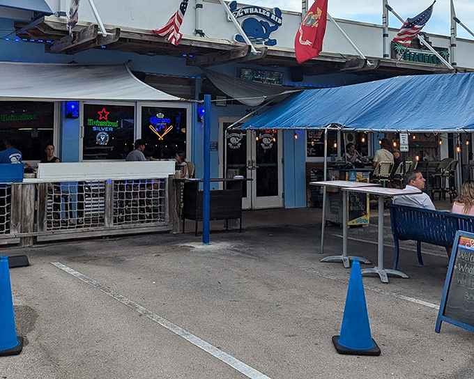 The unassuming blue facade of The Whale's Rib hides culinary treasures within, like a pirate's chest disguised as a beach shack.