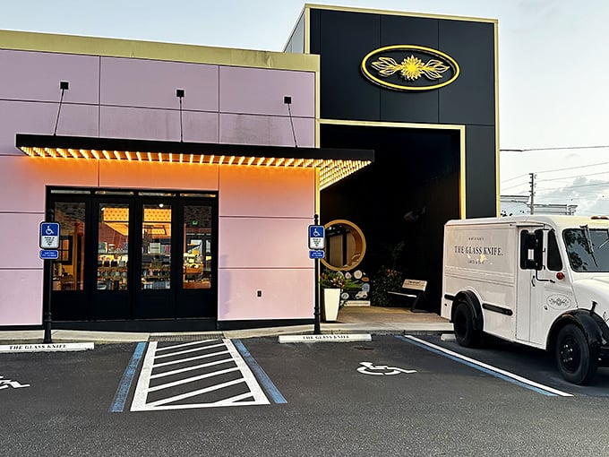 The Glass Knife's striking exterior blends modern architecture with a touch of whimsy&mdash;black panels meet that signature pink wall like formal wear accessorized with a playful pocket square.