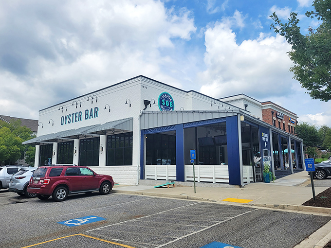 The crisp white exterior with navy blue accents makes Seaside Oyster Bar look like it teleported straight from a New England coast to suburban Suwanee.