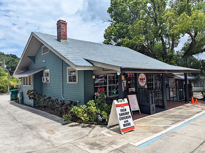 The unassuming green exterior of Tony's hides culinary treasures within, like a seafood speakeasy that forgot to keep the secret.