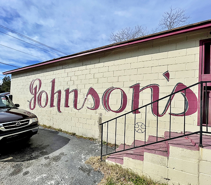 The unassuming exterior of Johnson's Restaurant proves once again that culinary treasures often hide in plain sight. That pink trim is your beacon to burger paradise.