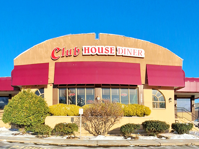 The Club House Diner's iconic red awnings and cream exterior stand as a beacon of comfort food promise in Bensalem. Like finding an old friend in a sea of chain restaurants.