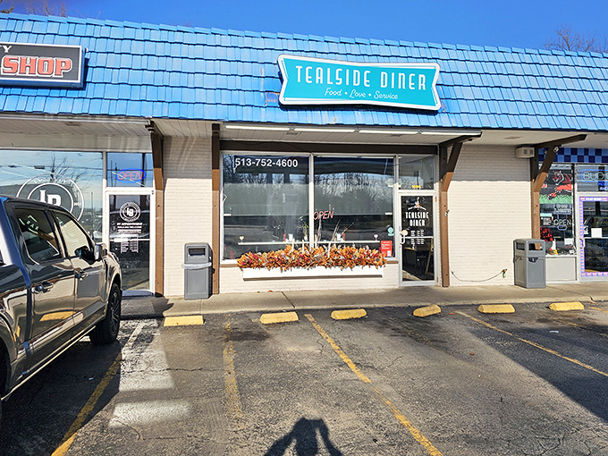 The blue roof of Tealside Diner stands out like a beacon of breakfast hope. This unassuming strip mall gem promises culinary treasures within.