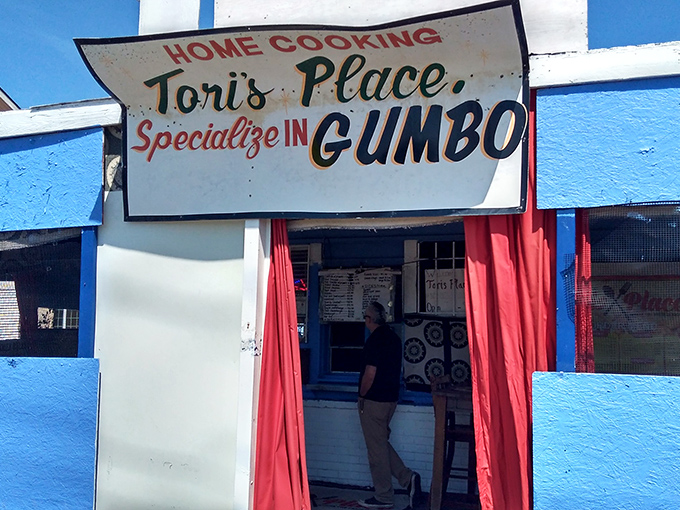 The blue beacon of culinary hope! Tori's Place announces its gumbo specialty with the confidence of someone who knows they've mastered their craft.