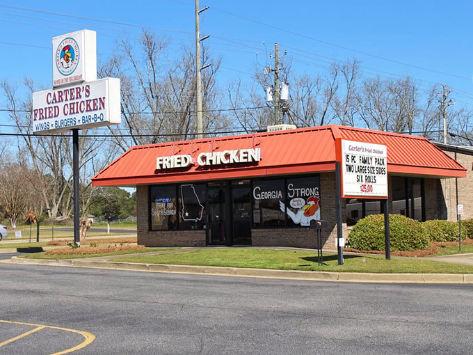The bright orange roof of Carter's Fried Chicken stands out like a beacon of hope for hungry travelers. Georgia Strong, indeed.