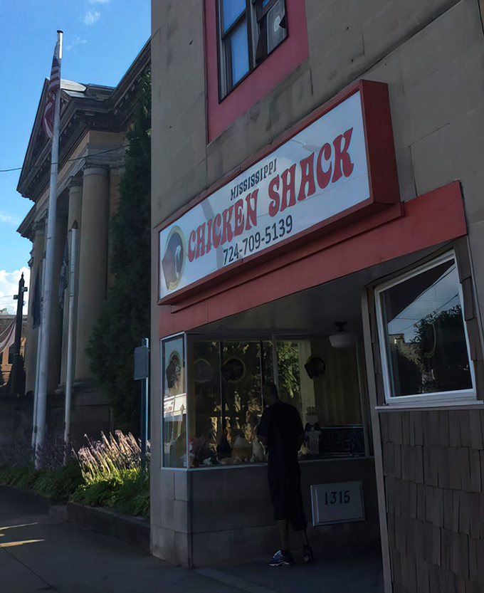 The unassuming exterior of Mississippi Chicken Shack might not stop traffic, but that red door is basically a portal to flavor paradise.